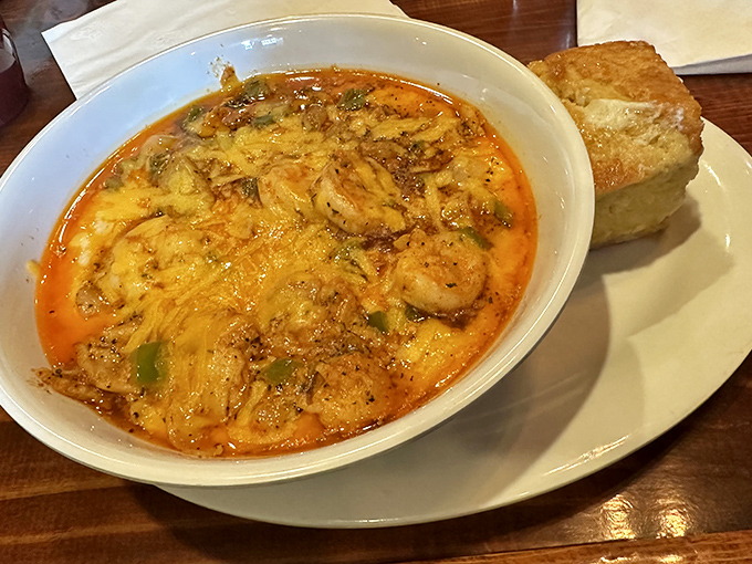 This bowl of shrimp and grits isn't just a meal&mdash;it's a warm, cheesy hug with seafood on top and a side of cornbread for good measure.