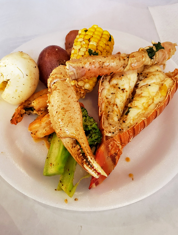 Snow crab legs and jumbo shrimp share a plate with corn and potatoes – the seafood equivalent of a perfect summer blockbuster.
