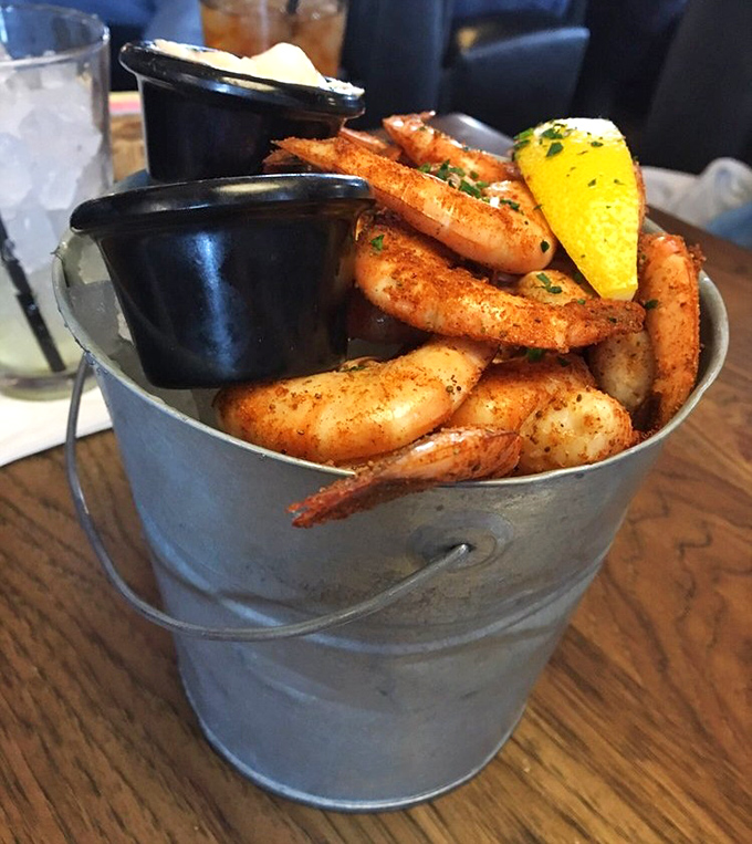 Peel and eat shrimp served in a metal bucket&mdash;seafood with a side of unpretentious fun. The lemon wedge isn't garnish; it's essential equipment.