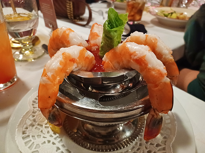 These jumbo shrimp hang off the edge of their silver throne like celebrities making a grand entrance at a premiere.