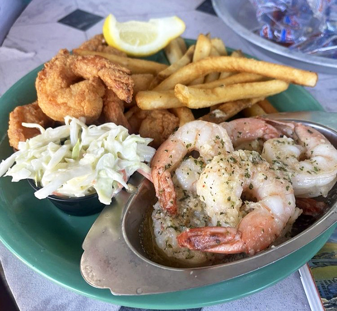 The seafood trifecta: fried shrimp, scampi, and coleslaw. This plate has more ocean treasures than a pirate's chest.