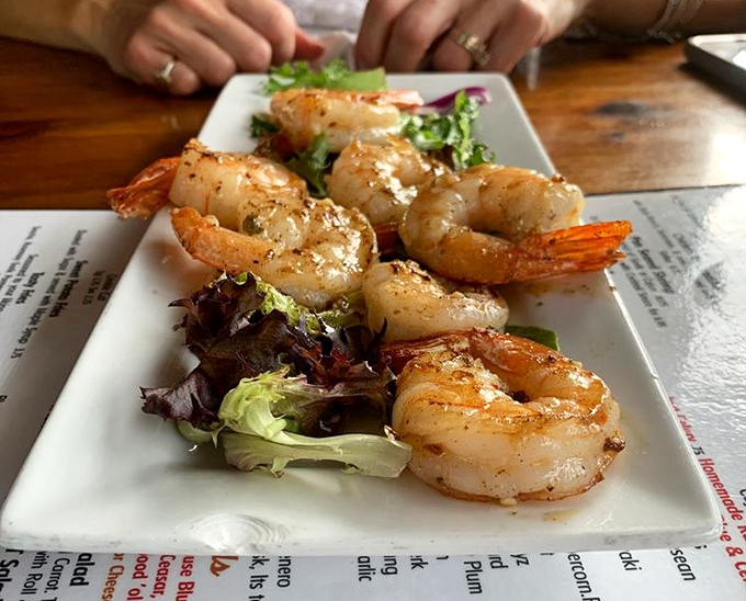 Perfectly seared shrimp perched atop fresh greens&mdash;proof that tavern food can be deliciously sophisticated when it wants to be, without getting all fancy-pants about it.