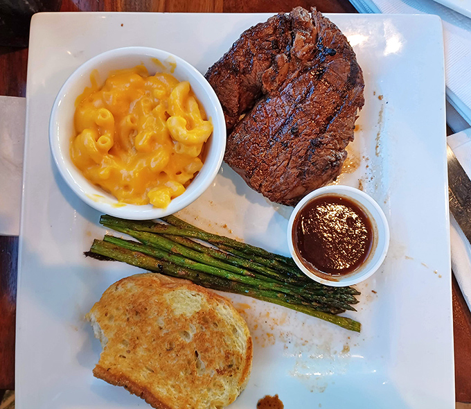 A perfectly cooked sirloin with mac and cheese and asparagus&mdash;the holy trinity of steakhouse satisfaction that speaks to both your inner child and sophisticated adult.