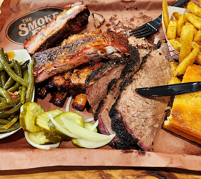 Brisket perfection on a platter &ndash; that pink smoke ring tells the whole delicious story.