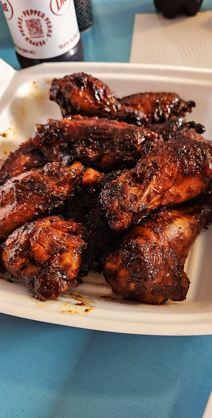Wings with a mahogany shine that would make fine furniture jealous. That sticky glaze is holding flavor hostage in the best way.