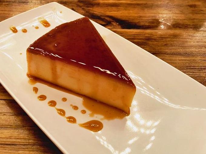This isn't just flan&mdash;it's smoked flan, because regular desserts are for restaurants that lack imagination. The caramel pools like liquid amber.