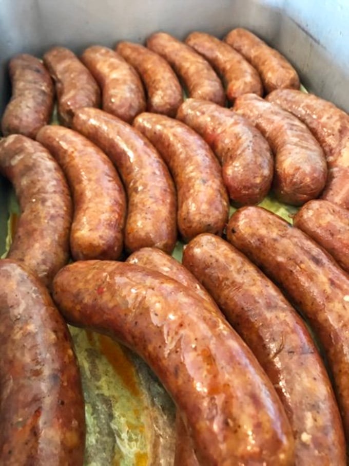 These sausages aren't just cooking&mdash;they're sunbathing in their own delicious juices, waiting to snap between your teeth with smoky perfection.