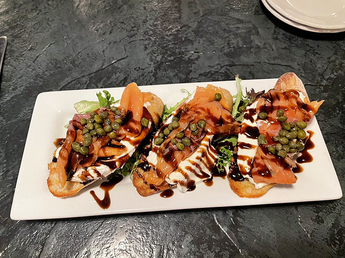 Smoked salmon bruschetta that's dressed to impress&mdash;like the culinary equivalent of showing up to a party in your finest outfit, ready to be the center of attention.