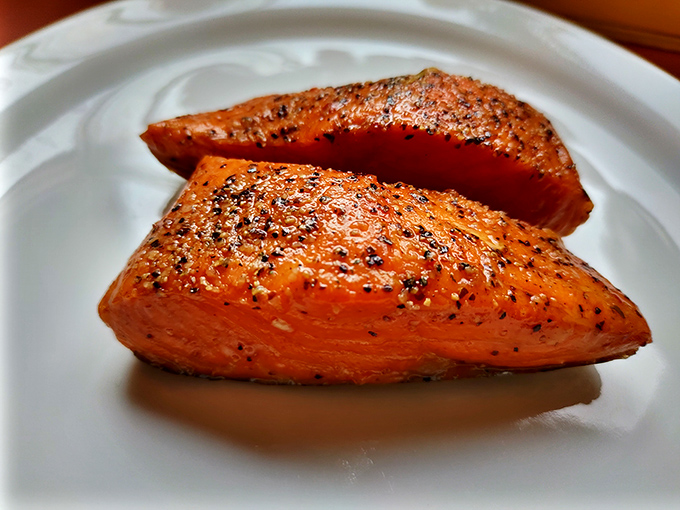 Smoked salmon so perfectly cooked it looks like it's blushing from all the compliments it's about to receive.