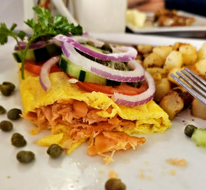 This omelet doesn't just contain salmon&mdash;it showcases it. With those fresh vegetables and perfect fold, it's breakfast elevated to an art form.