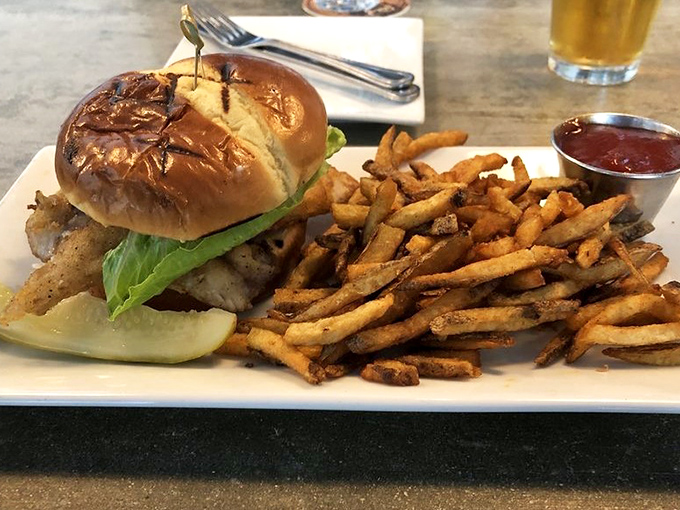 Proof that sandwiches can be life-changing experiences. Golden fries, toasted bun, and fresh fish &ndash; lunch doesn't get more satisfying than this.