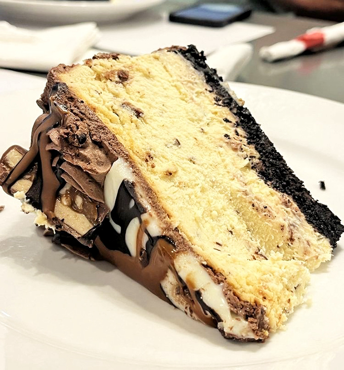 Not all heroes wear capes&mdash;some wear Oreo crusts. This Snickers cheesecake layer cake is what dessert dreams are built on.