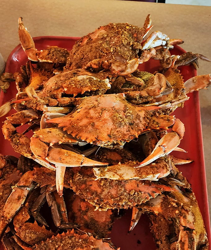 A mountain of seasoned blue crabs that makes seafood lovers weak at the knees. Tools required: wooden mallet, patience, and napkins.