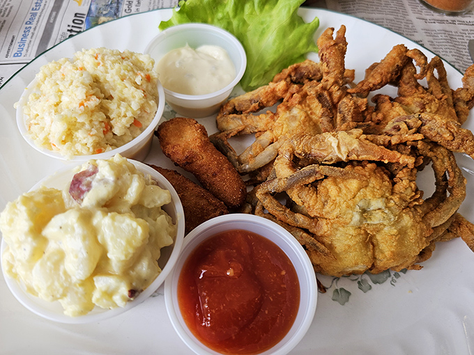 This seafood platter isn't just a meal; it's a celebration with potato salad and coleslaw joining the party.