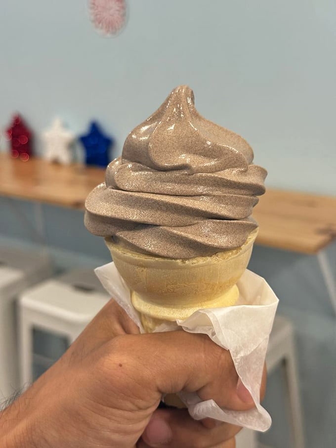 That soft serve swirl defies gravity and good sense. I'd climb mountains for that caramel-colored peak of perfection. 