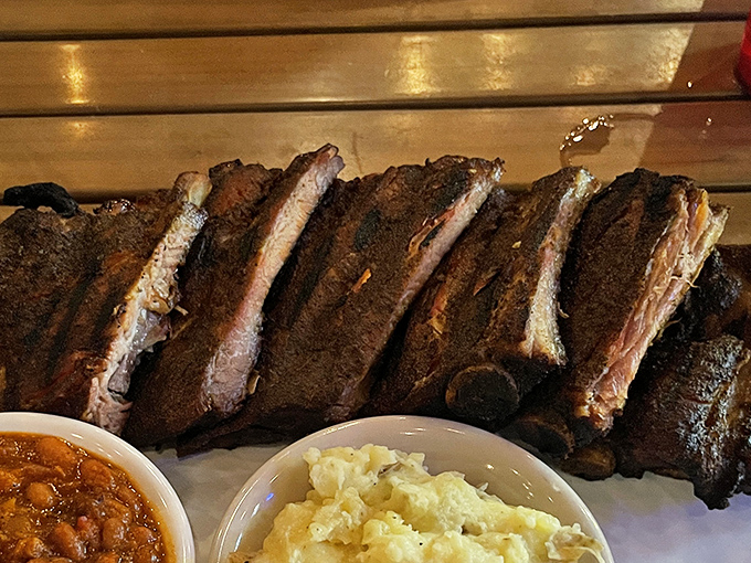 These ribs have that "fall-off-the-bone-but-still-have-a-little-chew" perfection that BBQ aficionados dream about. Sides of beans and potato salad complete the picture.