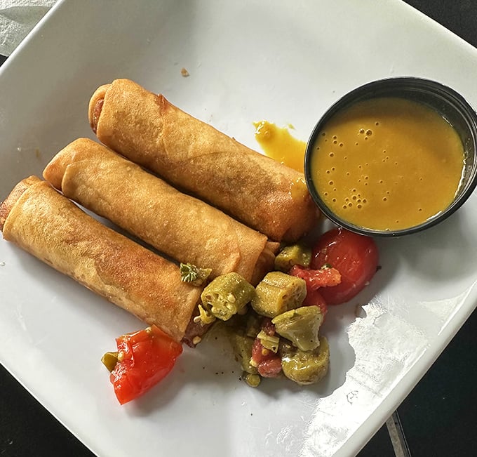 These aren't your average spring rolls—they're Southern innovation wrapped in crispy packages. The perfect marriage of technique and tradition.