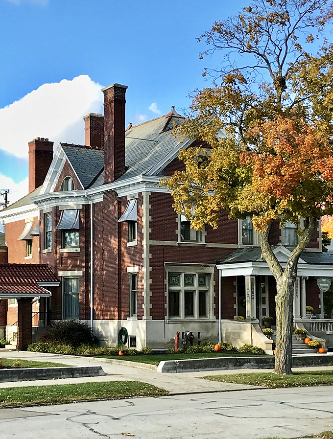This handsome brick residence showcases the elegant architectural details that give Greenville its distinctive character. Fall foliage provides the perfect accent.