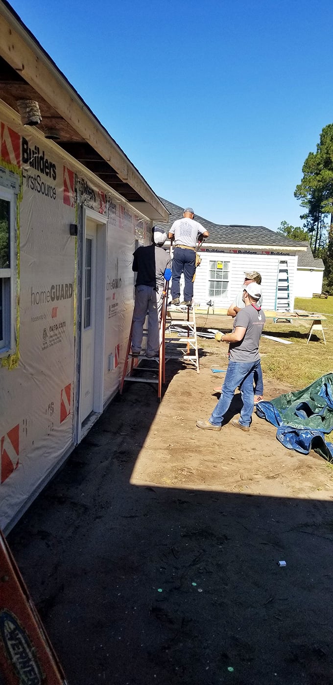 Where houses become homes&mdash;volunteers working on a Habitat build. Your ReStore purchases directly fund these life-changing construction projects.
