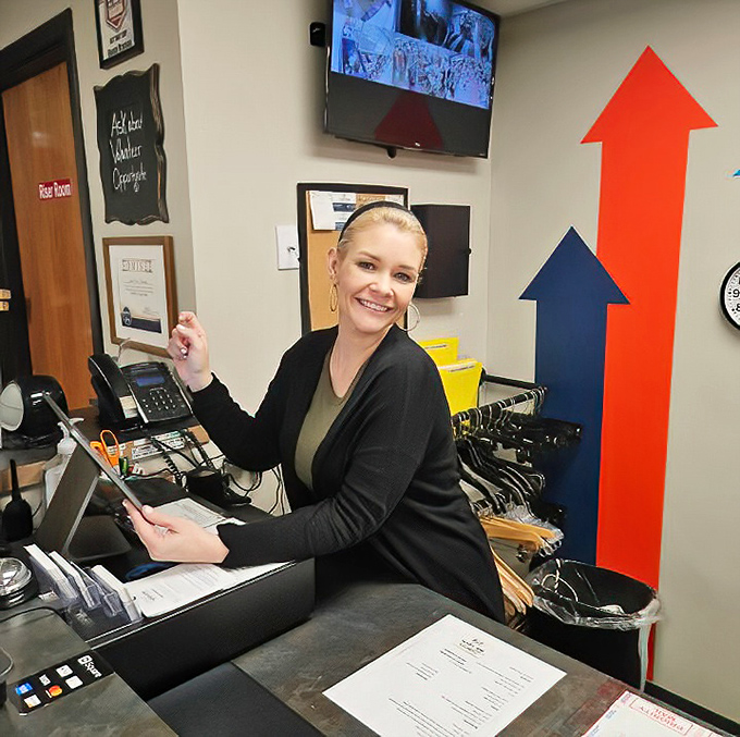 Behind every great thrift store is a friendly face ready to help. The arrows point up because that's where your savings go when shopping here.