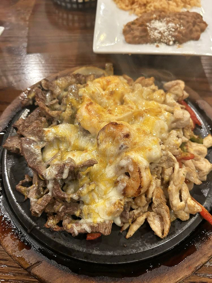 The sizzling fajita platter&mdash;where dinner and dramatic entrance become one glorious, cheese-covered spectacle that turns every head in the room.