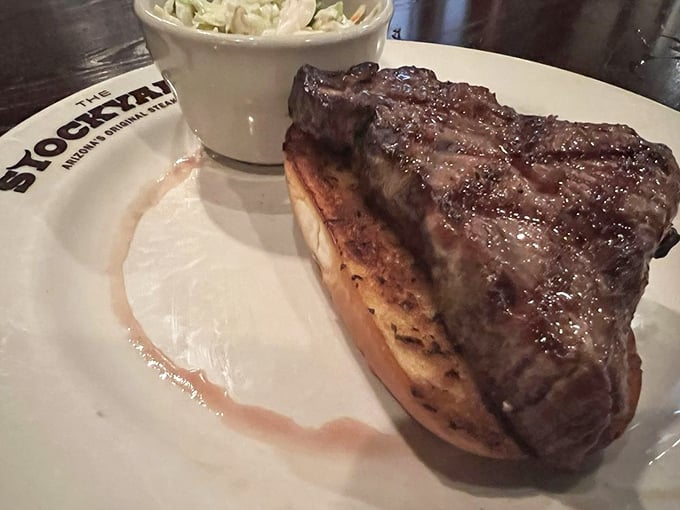 This isn't just a steak sandwich—it's architecture. A masterpiece of beef perched atop bread that knows its supporting role.