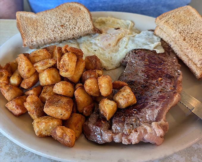 The classic steak and eggs&mdash;when you can't decide between breakfast and dinner, so you have both. Those home fries are the supporting actors who steal the show.