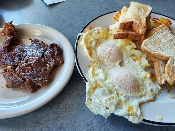 The breakfast of champions: eggs sunny-side up with toast and a steak that's seen just enough grill time to make it blush.