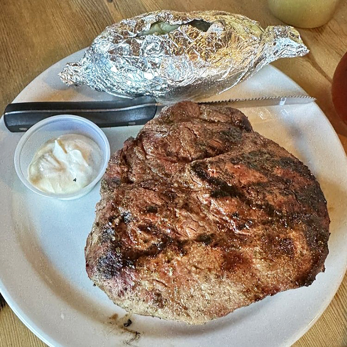 When your steak arrives looking like it could feed a small village. The char marks tell stories of open flames and generations of grilling wisdom.