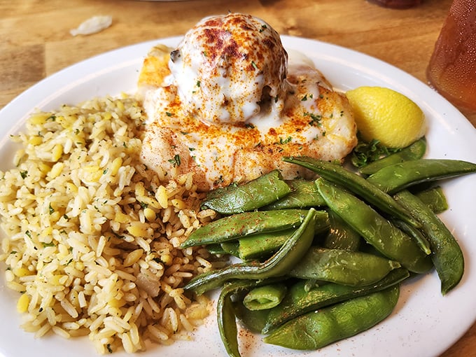 When fish gets the royal treatment: stuffed grouper lounging on a bed of rice with snap peas standing guard.