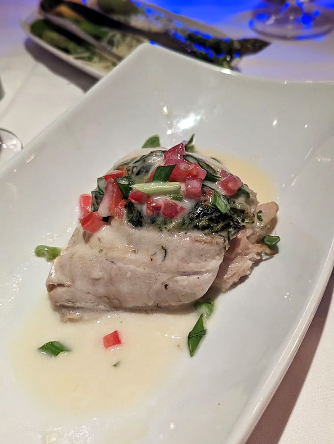 This delicate fish presentation proves that sometimes the best seafood doesn't need to shout&mdash;it just whispers of ocean freshness with every bite.