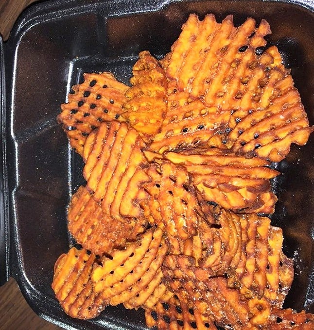 Sweet potato waffle fries that achieve the impossible: crispy exterior, pillowy interior, and enough seasoning to make you forget regular fries exist.