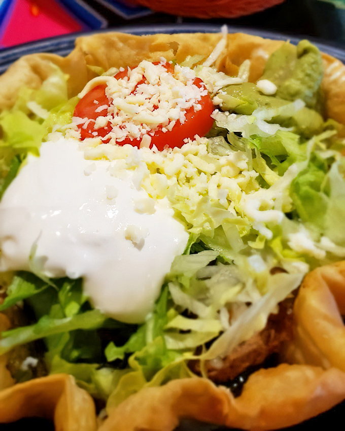 This taco salad bowl doesn't just hold ingredients&mdash;it cradles them. The crispy tortilla shell creates the perfect vessel for that mountain of freshness inside.