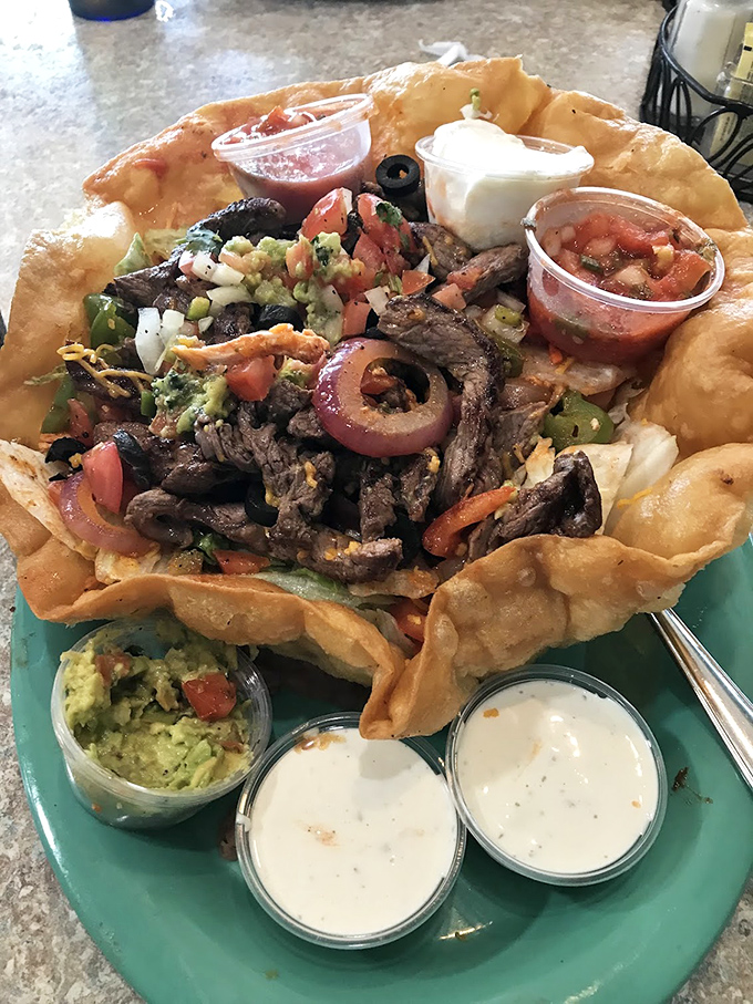 This isn't just a taco salad&mdash;it's an edible fortress of flavor, complete with its own moat of sauces and a garrison of fresh toppings.