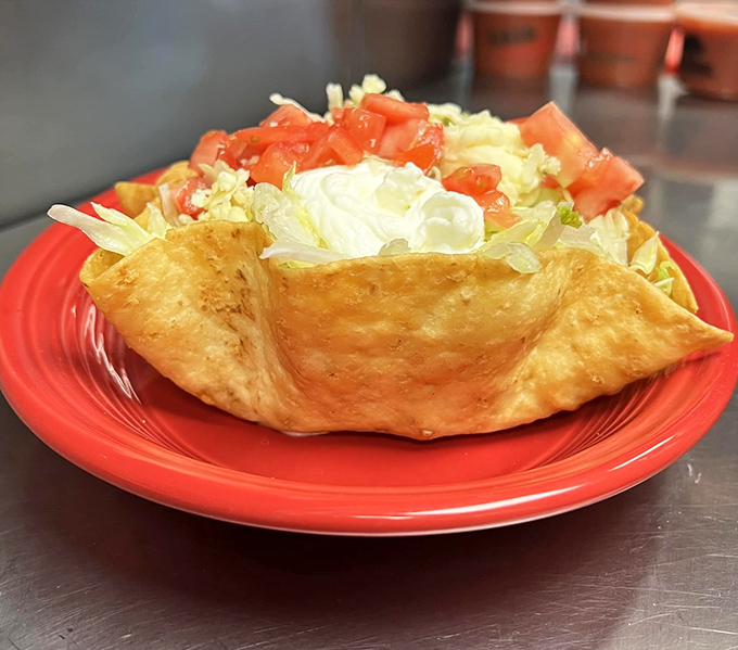 A taco salad that's dressed for success&mdash;crispy shell, fresh toppings, and enough lettuce to convince yourself it's practically health food.