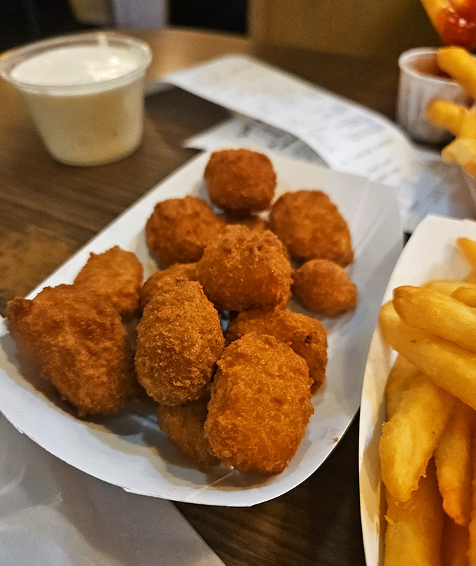 Golden-brown nuggets of happiness that crunch like childhood memories. These aren't just tater tots&mdash;they're edible nostalgia.