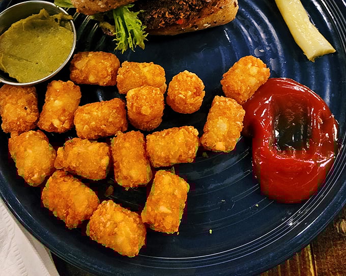 Golden-brown tater tots that shatter with each bite, served with dipping sauces that make you question why french fries get all the glory.