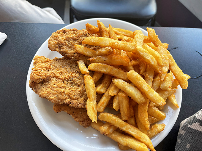 Golden-brown perfection meets potato paradise—these tenders and fries are what fast food chains wish they could produce.