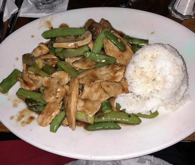 Simple yet sublime: tender chicken and snap-fresh green beans. Sometimes paradise comes on a white plate with a side of rice.