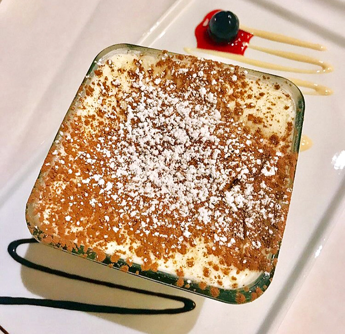This tiramisu isn't just dessert&mdash;it's therapy in a square dish. The dusting of cocoa powder is like a warm Italian sunset over creamy mascarpone hills.