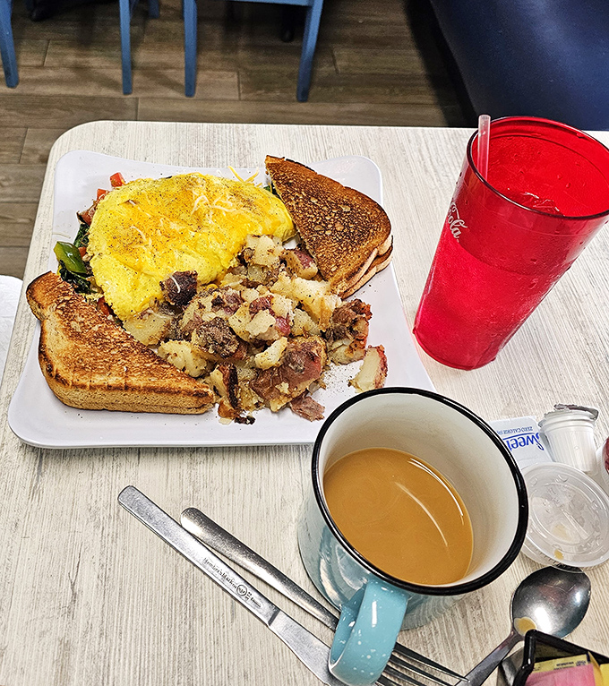 A perfectly executed omelet with crispy toast and seasoned potatoes proves that sometimes the classics deserve their legendary status for good reason.