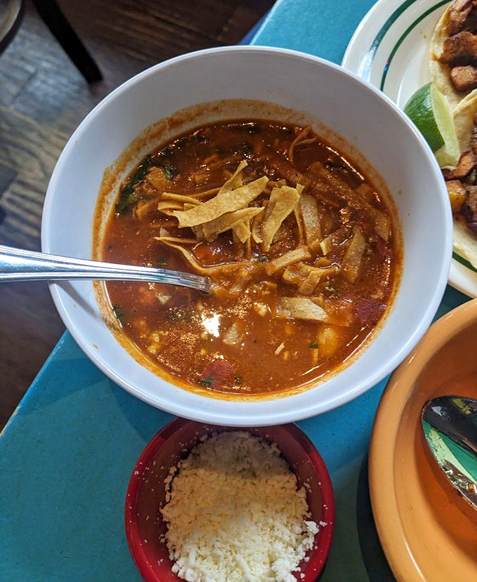 Rich tortilla soup arrives like a warm hug from your favorite Mexican grandmother's kitchen.