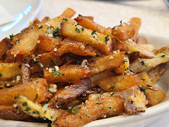 These aren't just fries; they're potato royalty, dressed in herbs and parmesan, demanding respect with every crispy bite.
