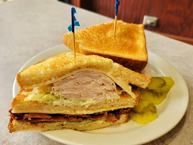 Turkey and bacon unite in sandwich harmony, like Simon and Garfunkel but with better chemistry.