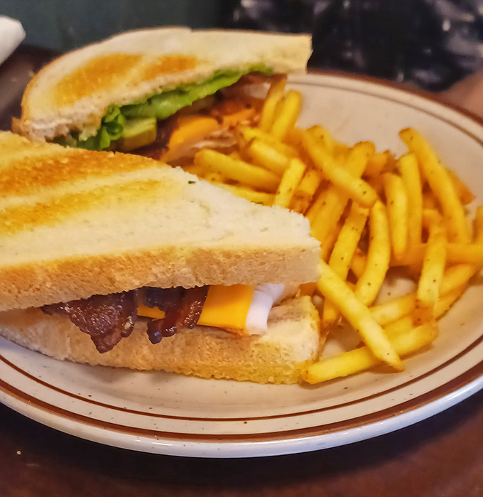 The Turkey Club isn't just a sandwich; it's architecture&mdash;layers of smoked turkey, bacon, and fresh veggies creating a skyscraper of flavor that demands to be admired before demolished.