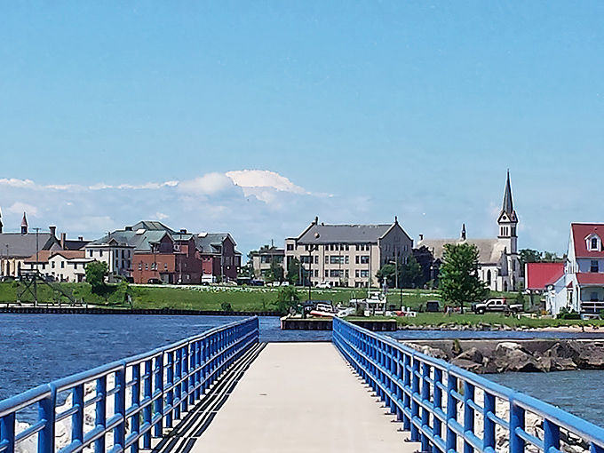 This blue pier stretches toward Two Rivers' charming skyline like an invitation to explore a town where church steeples still dominate the horizon.