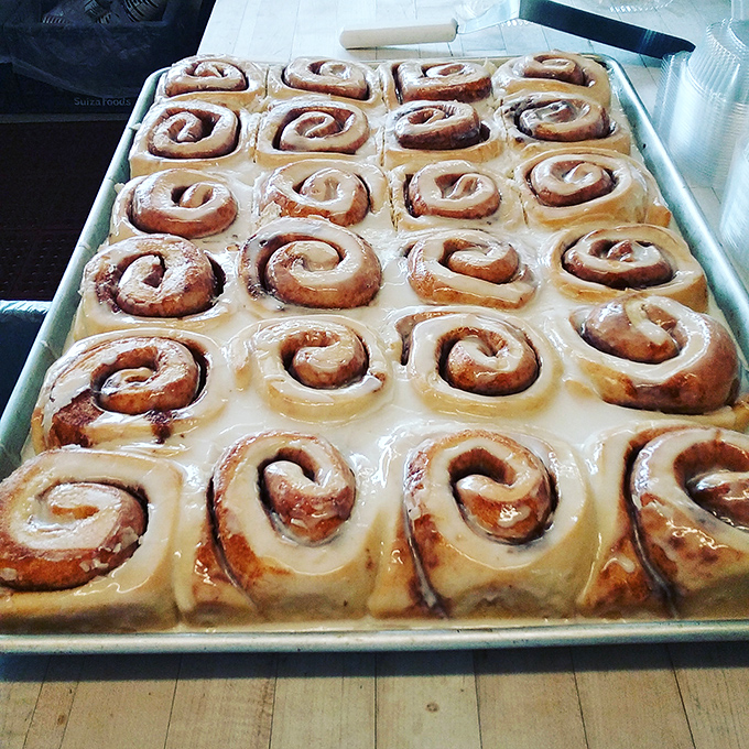 Cinnamon rolls lined up like edible soldiers in a delicious army. That glaze isn't just topping&mdash;it's liquid sunshine for your taste buds. 