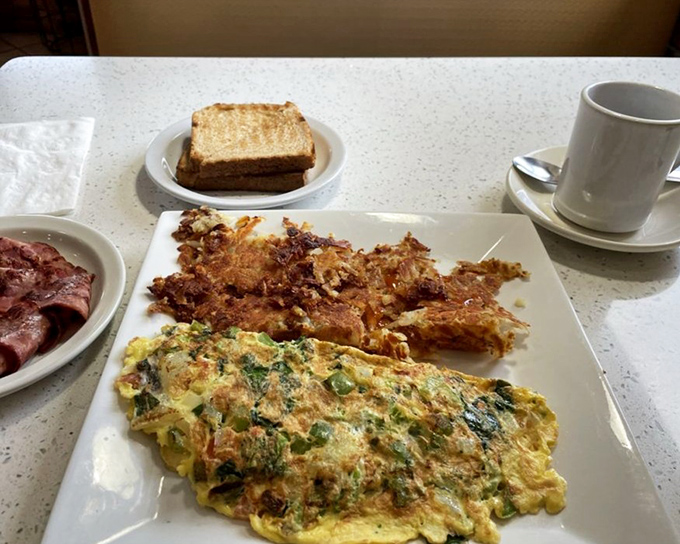 Garden party on a plate! This vegetable omelet proves that eating your greens can be the highlight of breakfast, not the compromise.