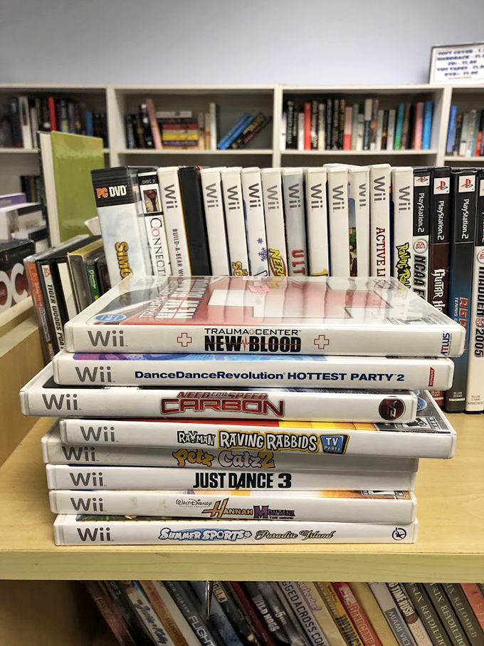 A stack of Wii games that takes you back to when "Just Dance 3" was the reason your living room furniture got rearranged every weekend.