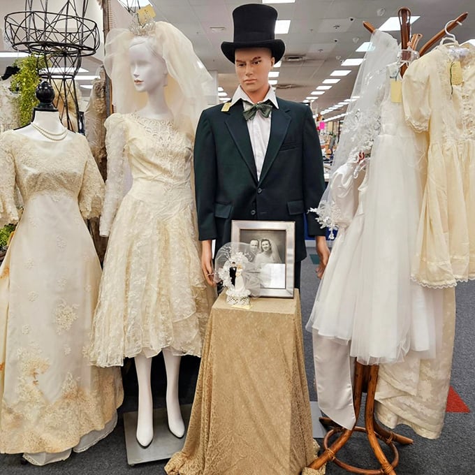 A dapper gentleman in vintage wedding attire stands guard over decades of matrimonial memories.
